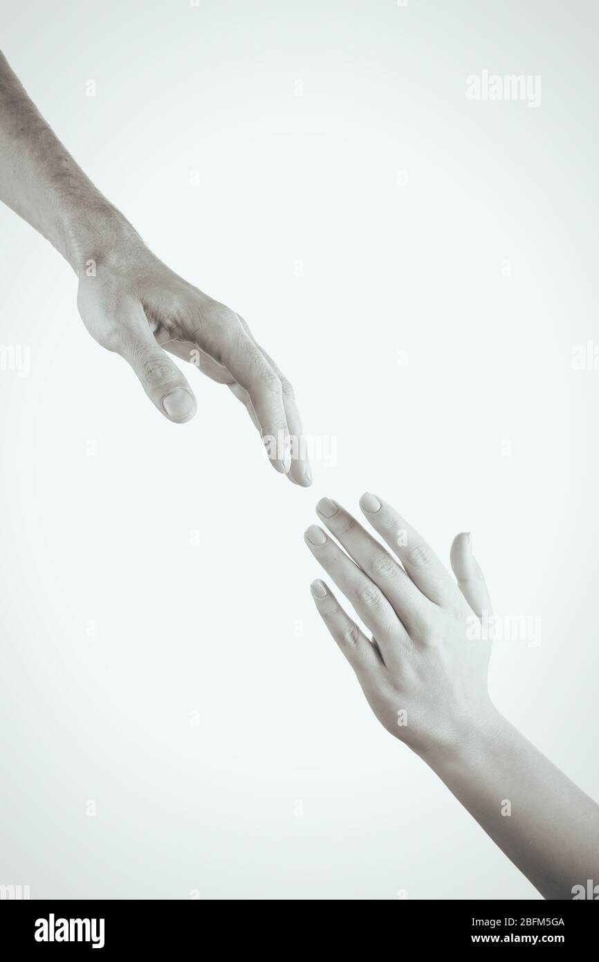 Two hands reaching toward each other. Helping concept. Vintage tone ...