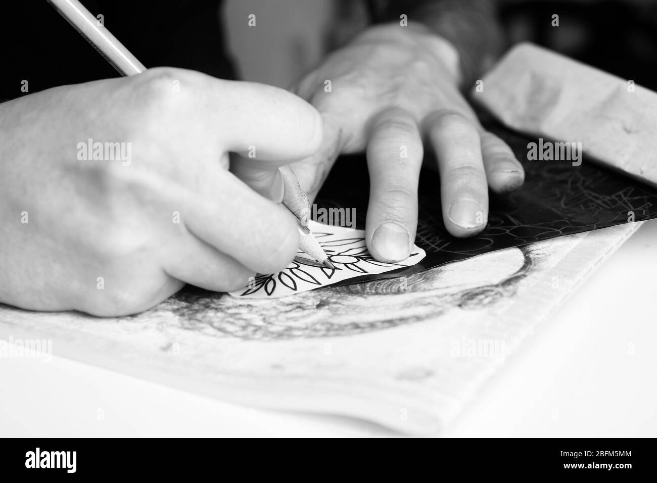 Professional tattoo artist drawing sketch Stock Photo - Alamy