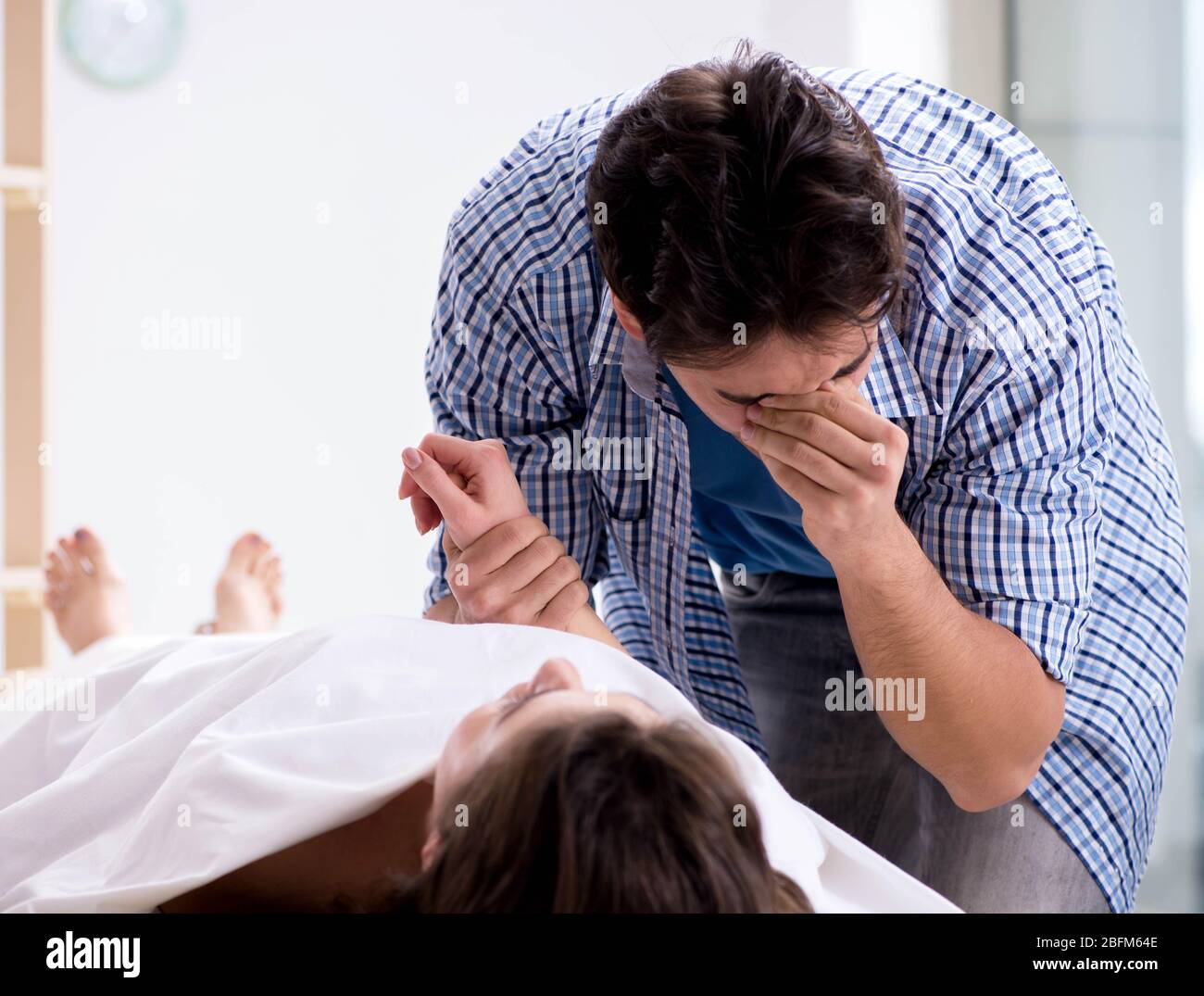 The man mourning his dead wife Stock Photo - Alamy