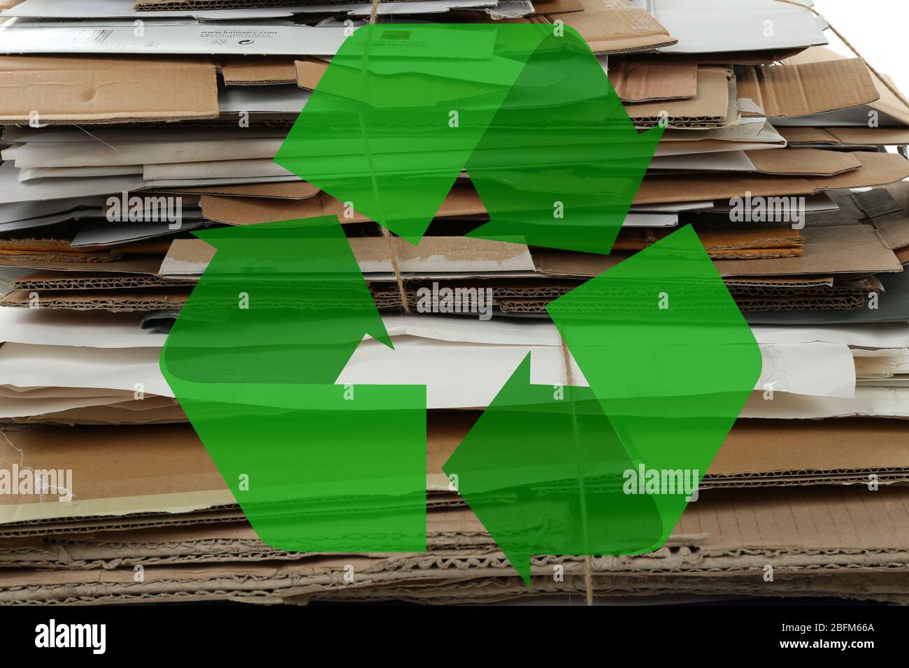 Big stack of papers and recycle sign Stock Photo - Alamy
