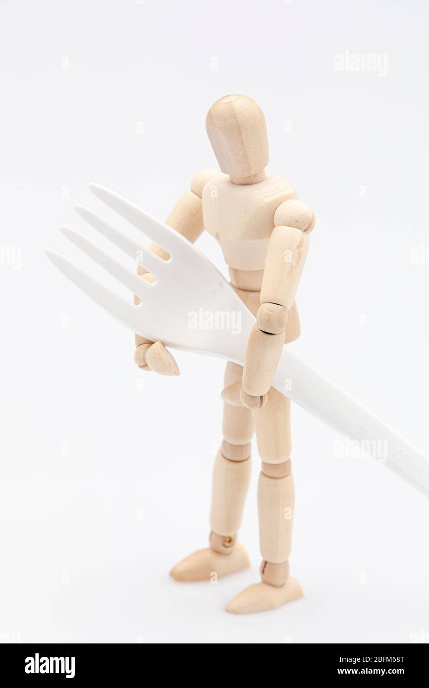 Wooden dummies carrying a biodegradable fork in front of a white ...