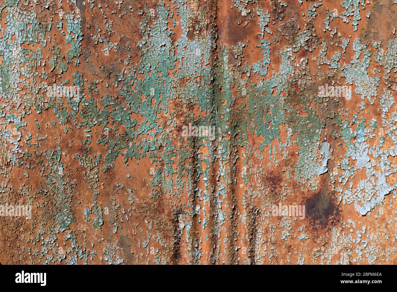 Closeup background of ridged metal with crazed paint and rust texture ...