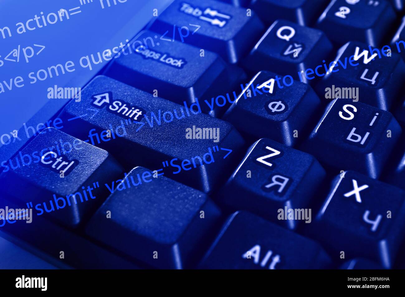 Computer keyboard with program code Stock Photo - Alamy