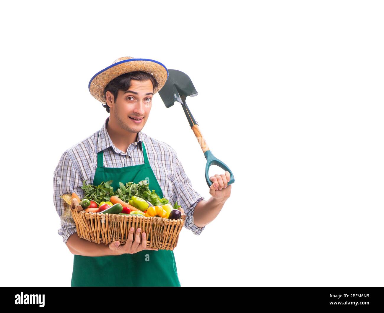 The young farmer with fresh produce isolated on white background Stock ...
