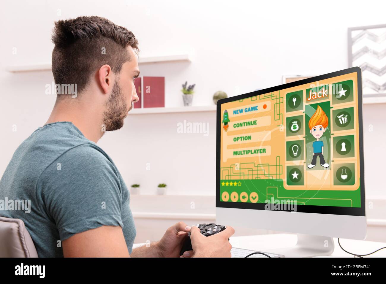 Young man playing computer games at home Stock Photo - Alamy