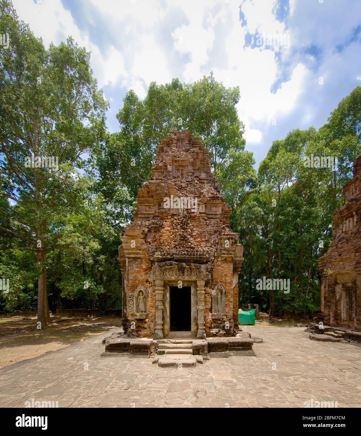 Brick and stone ruined stupas and terrace and the entrance of Preah Ko ...
