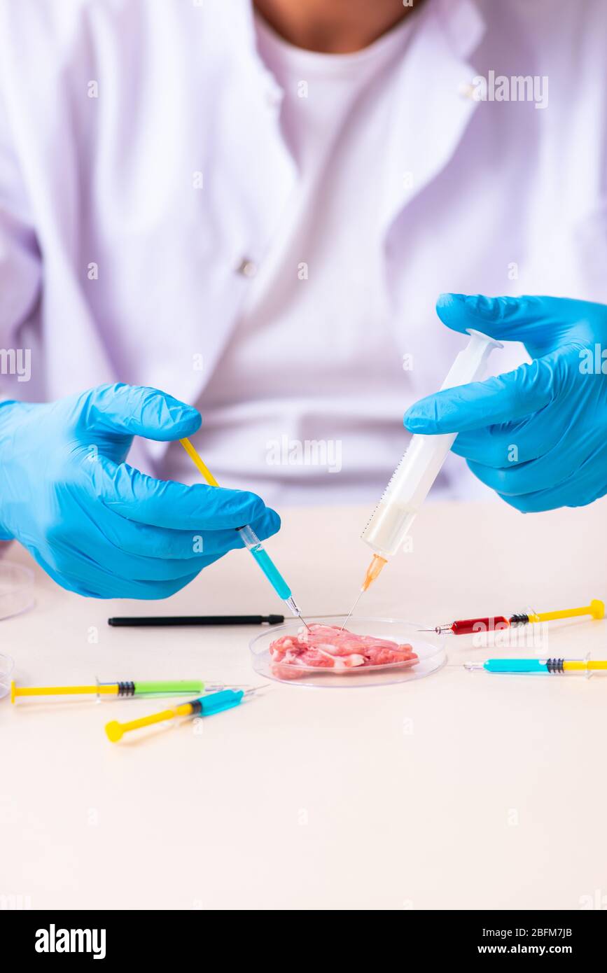 Young nutrition expert testing food products in lab Stock Photo - Alamy