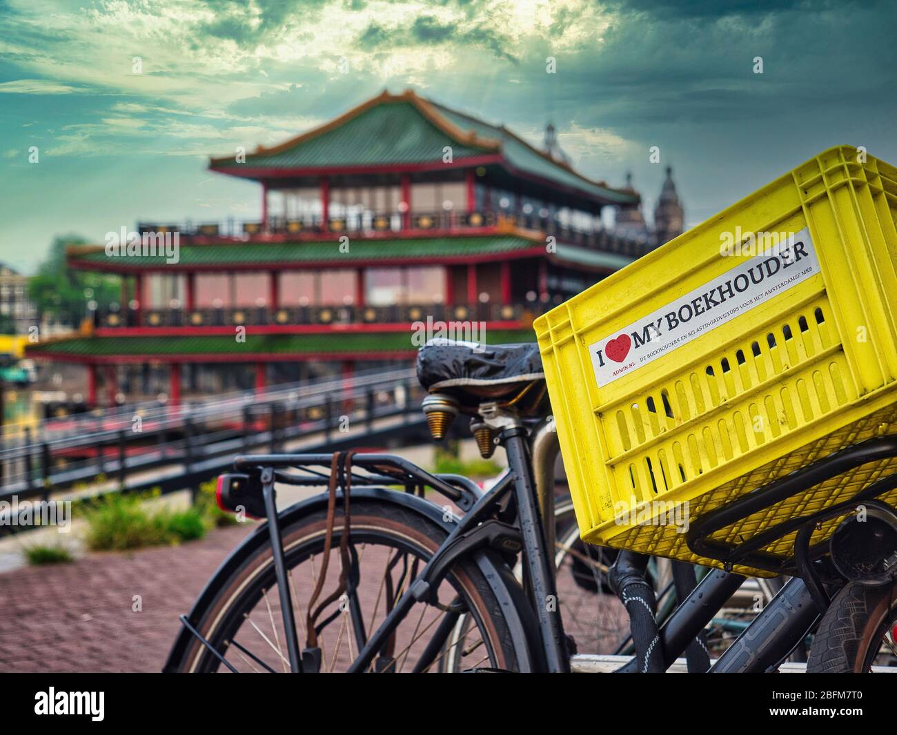 Biking in Amsterdam with Chinese restaurant in the background Stock ...