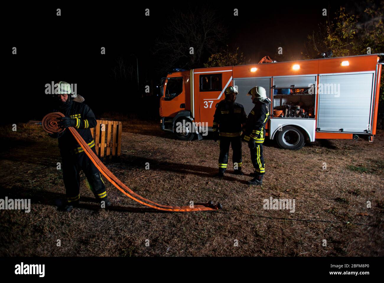 Firefighters preparing various tools used for eliminating fire hazards ...