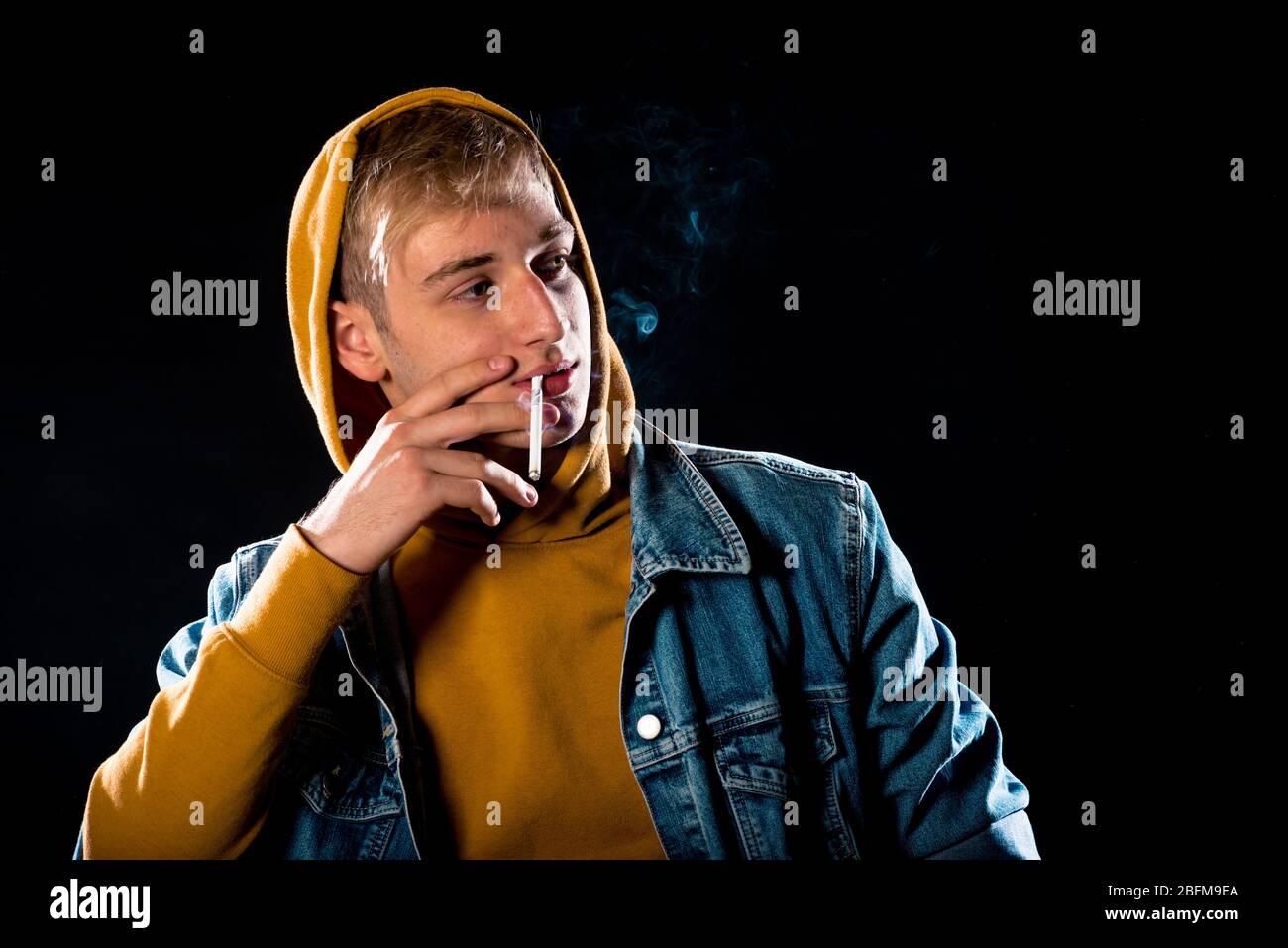 Cool handsome trendy guy wearing stylish hoody Stock Photo - Alamy