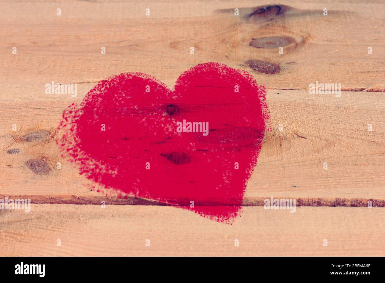 Red heart painted on old wooden wall background Stock Photo - Alamy