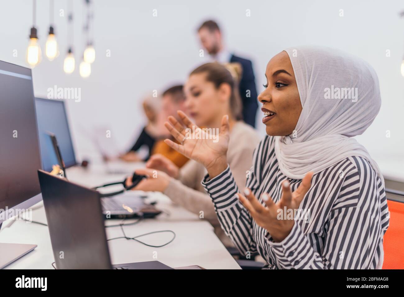 Muslim woman female front desk hi-res stock photography and images - Alamy