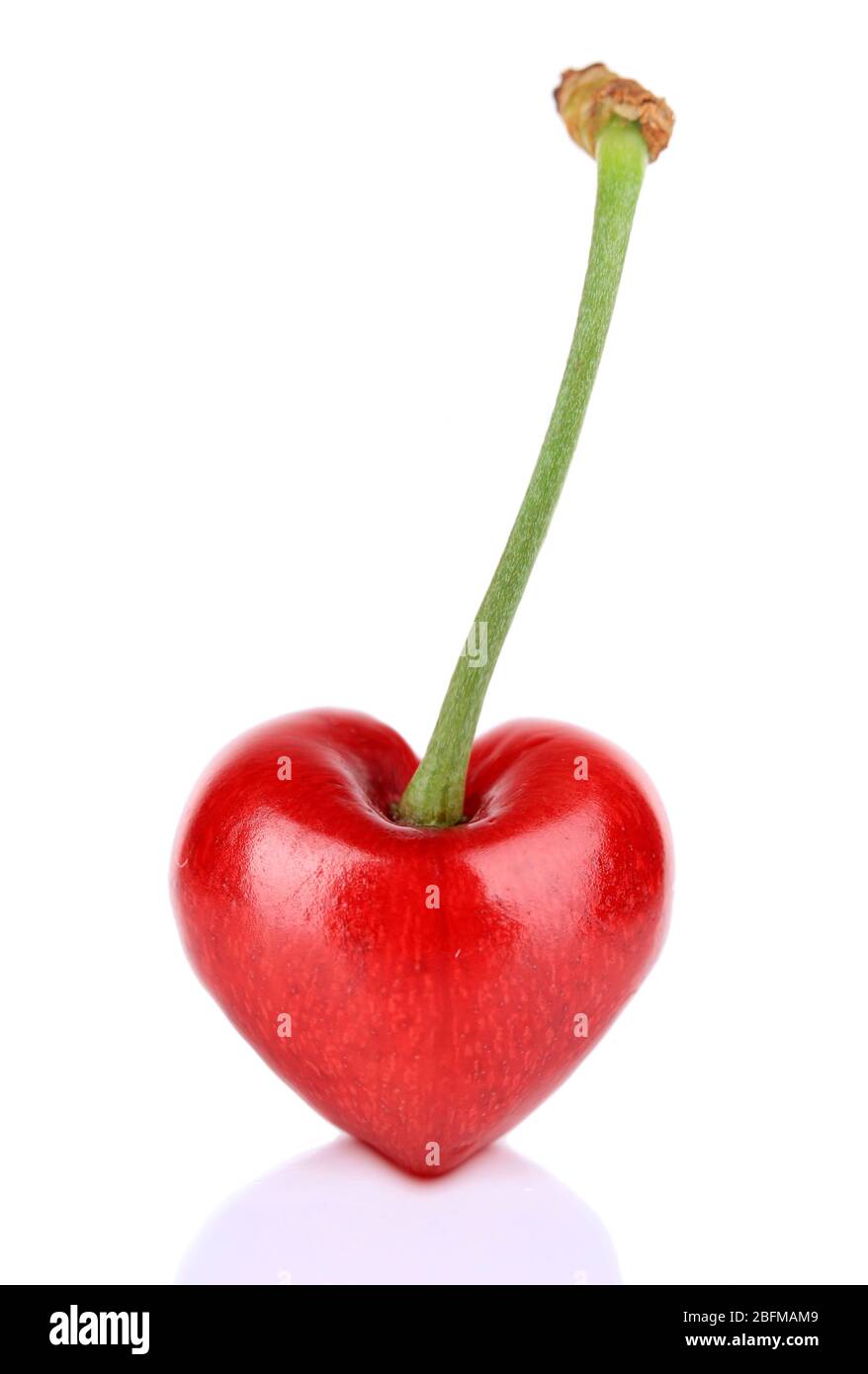 Sweet cherry in heart shape isolated on white Stock Photo - Alamy