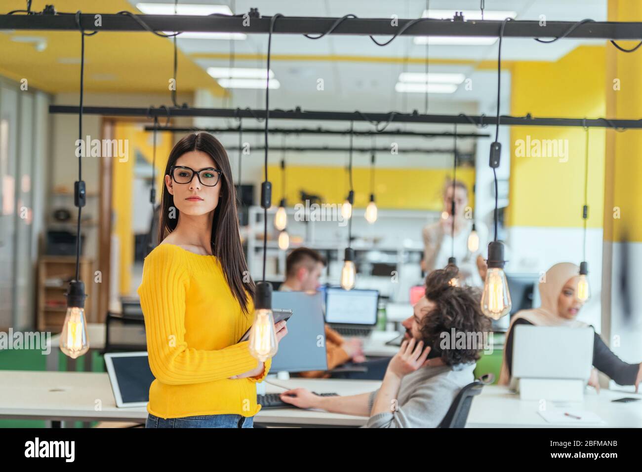 Female boss, manager executive posing in a modern startup office while ...