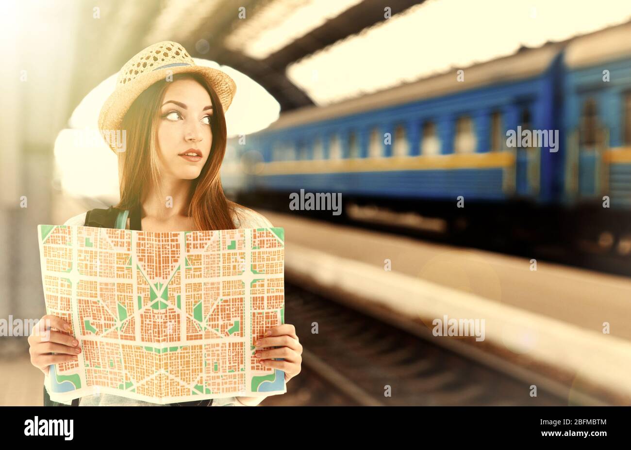Traveler with map Stock Photo - Alamy