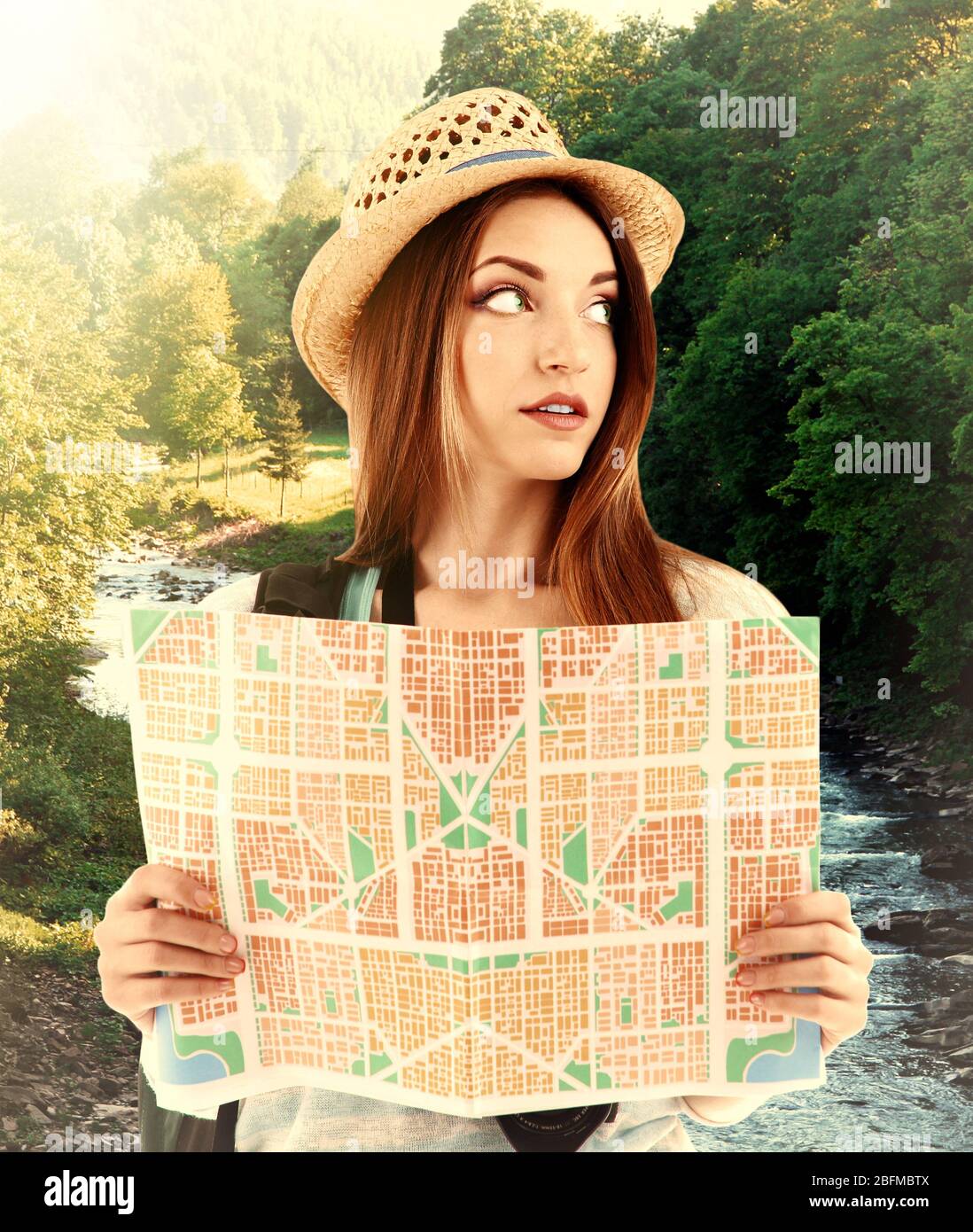 Traveler with map on nature background Stock Photo - Alamy
