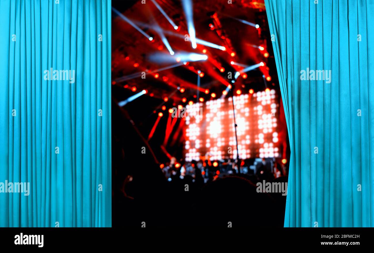 Blue curtain on concert stage slightly open Stock Photo - Alamy