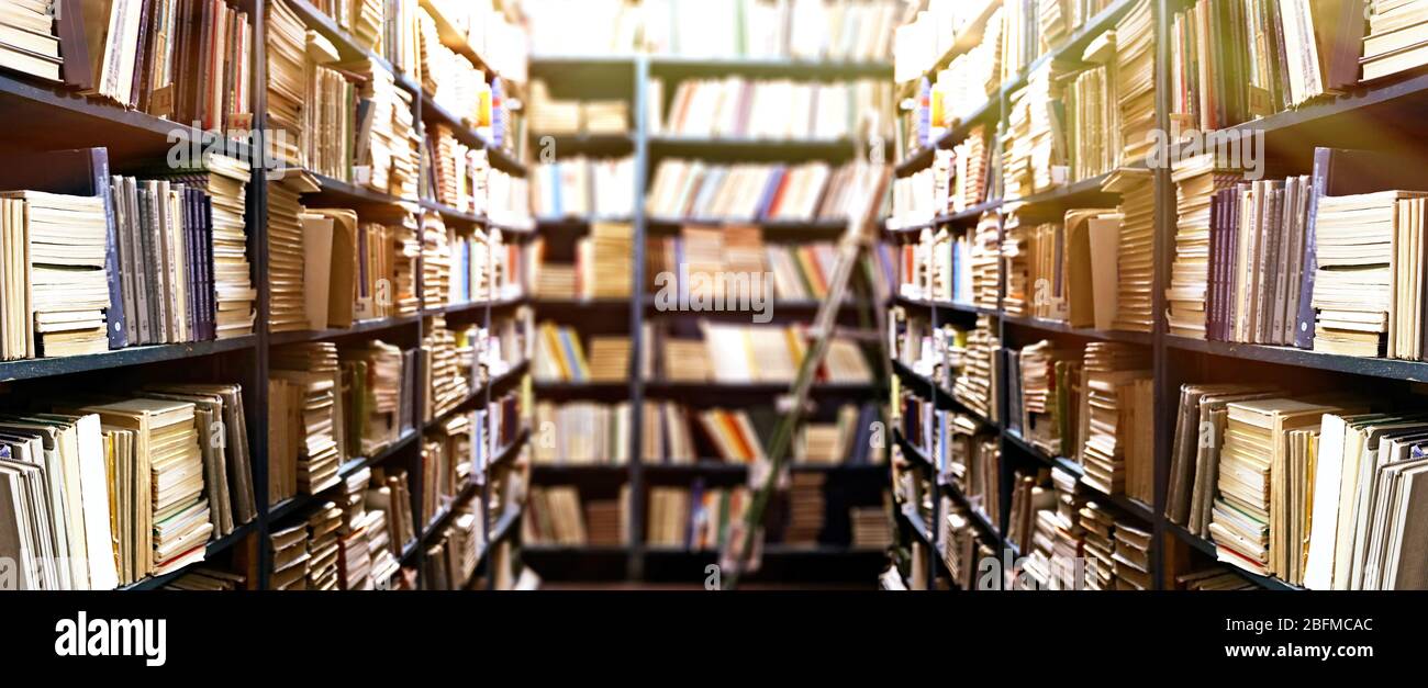 Library bookshelves background Stock Photo - Alamy