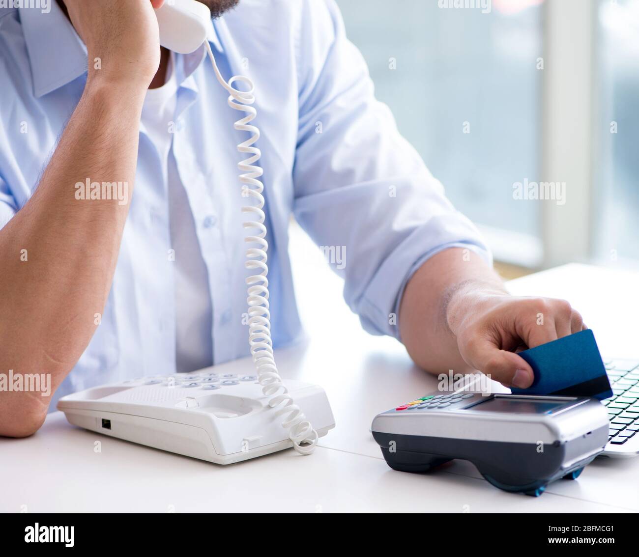 The man processing credit card transaction with pos terminal Stock ...