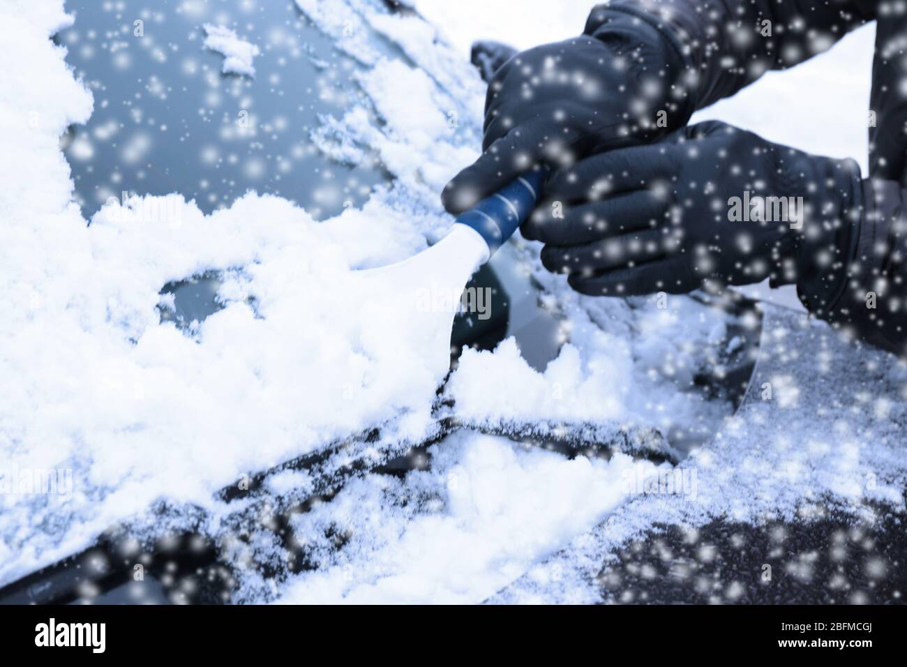 Winter driving, scraping snow from a windshield Stock Photo - Alamy