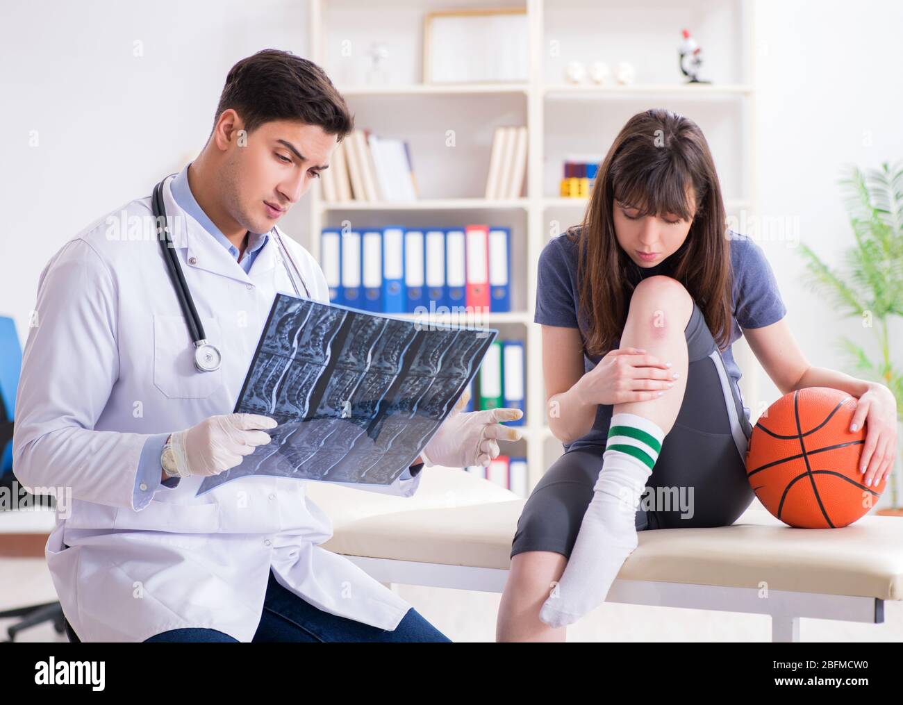 The female basketball player visiting doctor after injury Stock Photo ...