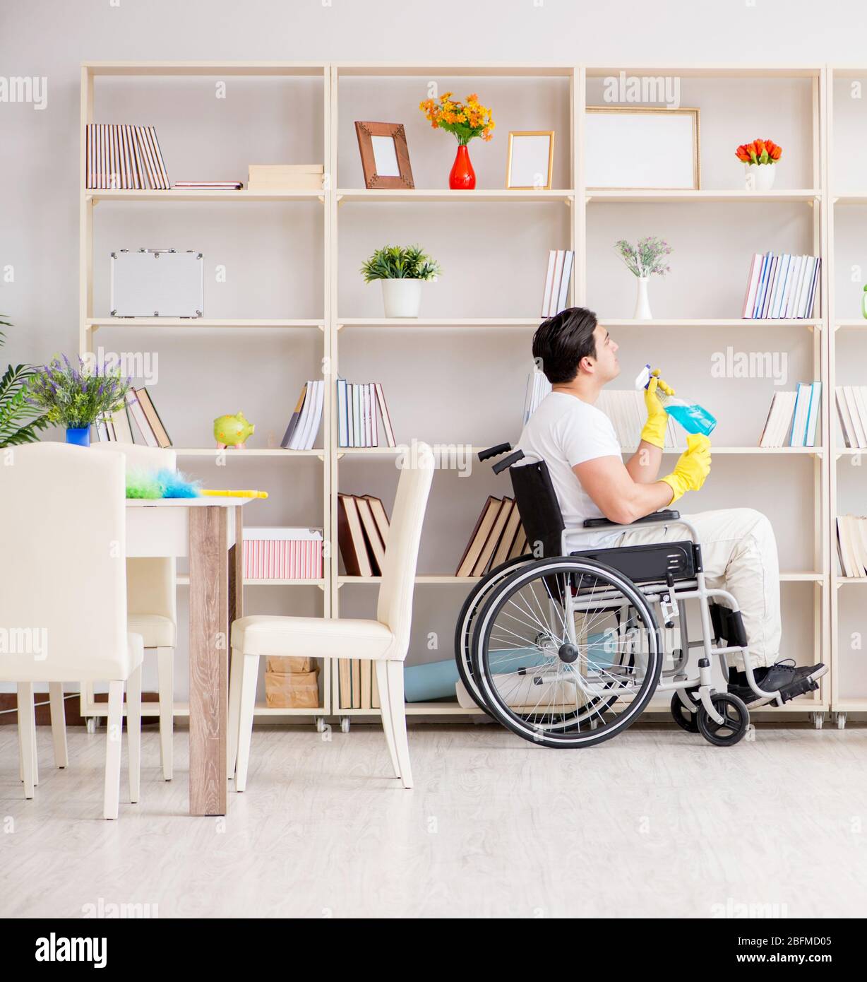 The disabled cleaner doing chores at home Stock Photo - Alamy