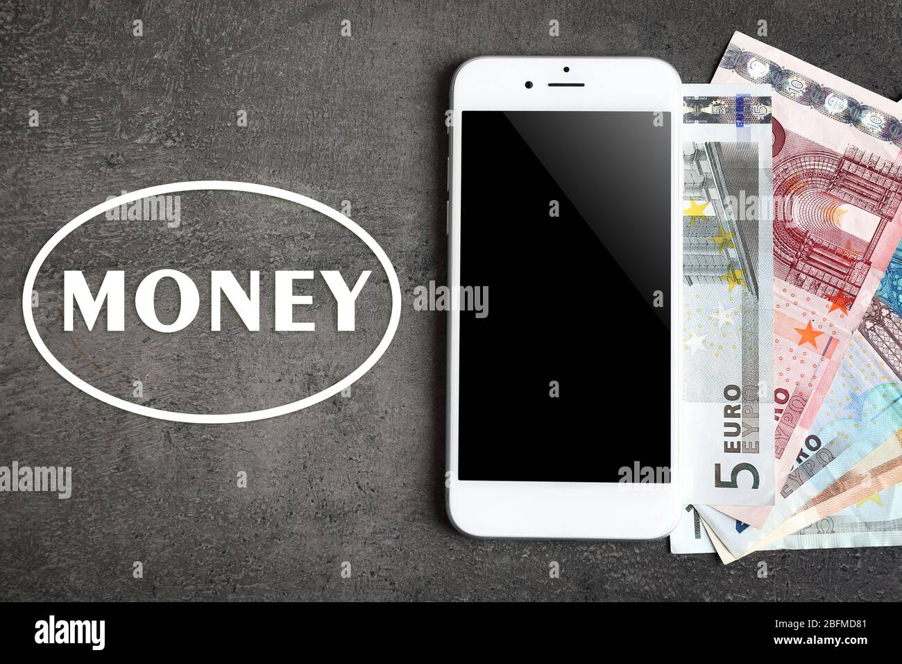 Mobile phone and money on grey background. Concept of payment and ...