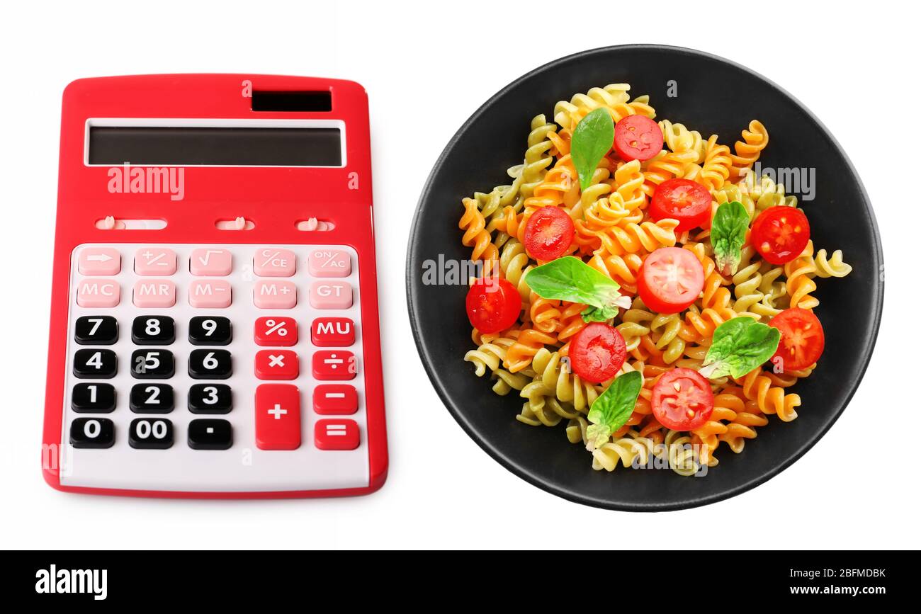 Calculator and delicious pasta with tomatoes and basil leaves isolated ...