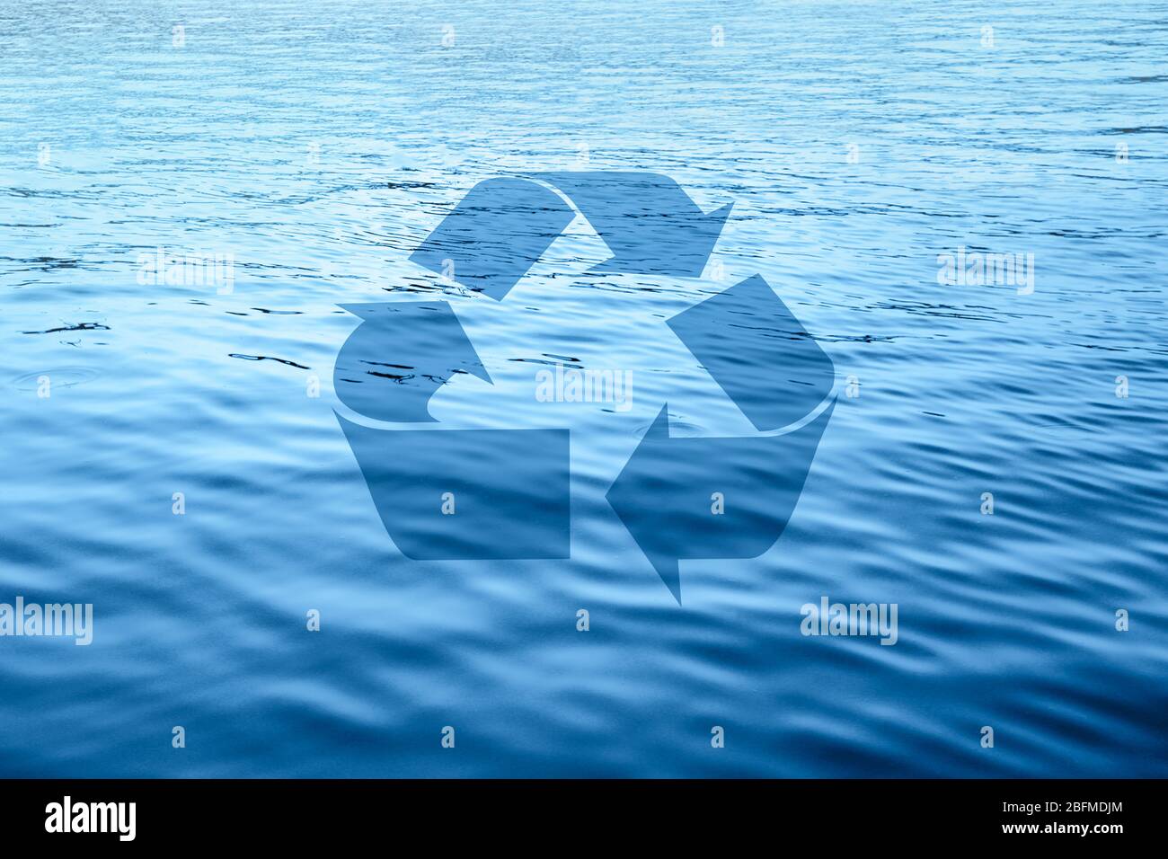 Recycling symbol on water background Stock Photo - Alamy