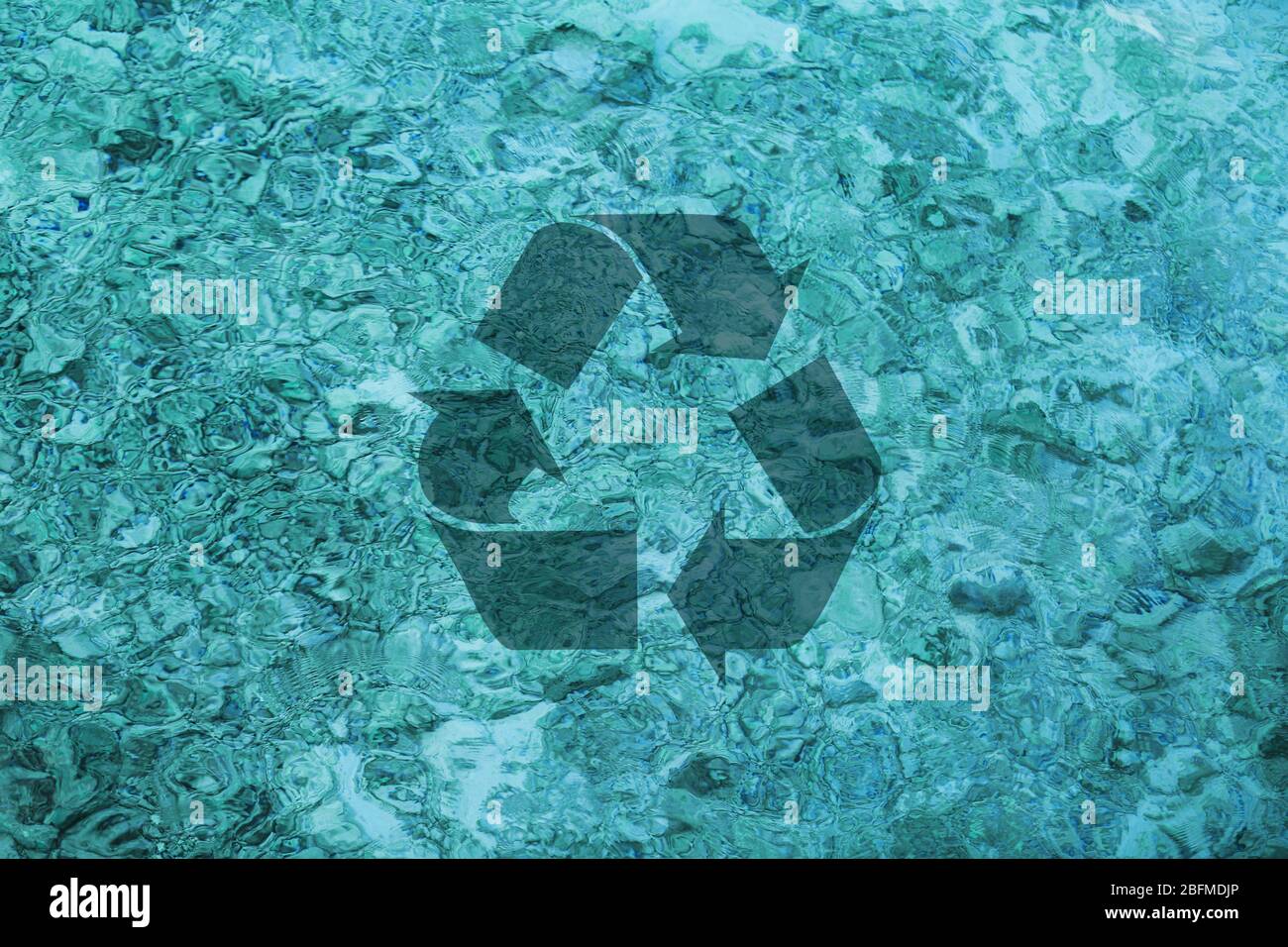 Recycling symbol on water background Stock Photo - Alamy
