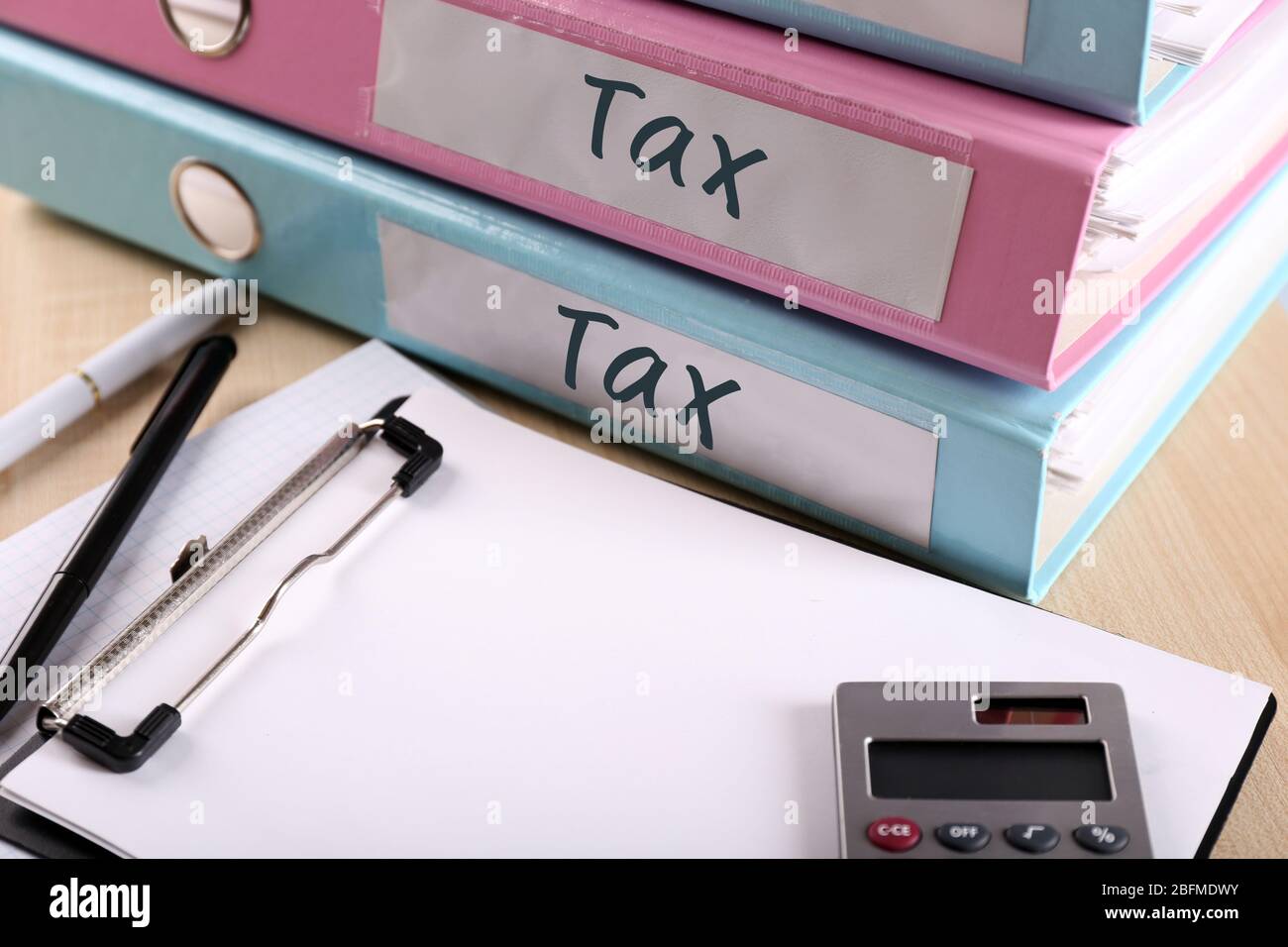 Taxes folder with office tools Stock Photo - Alamy