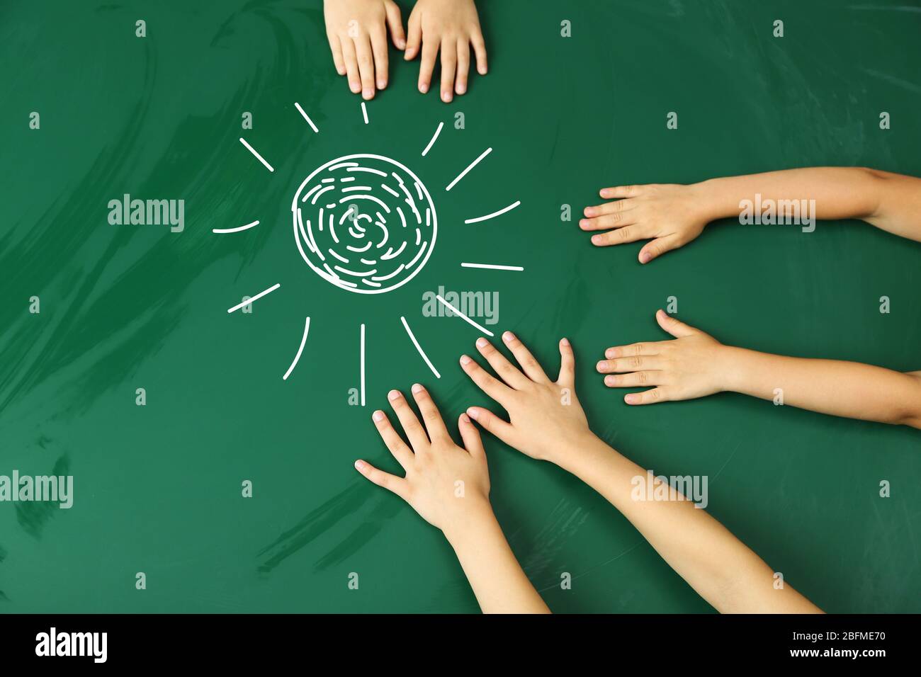 Children hands on blackboard background Stock Photo - Alamy
