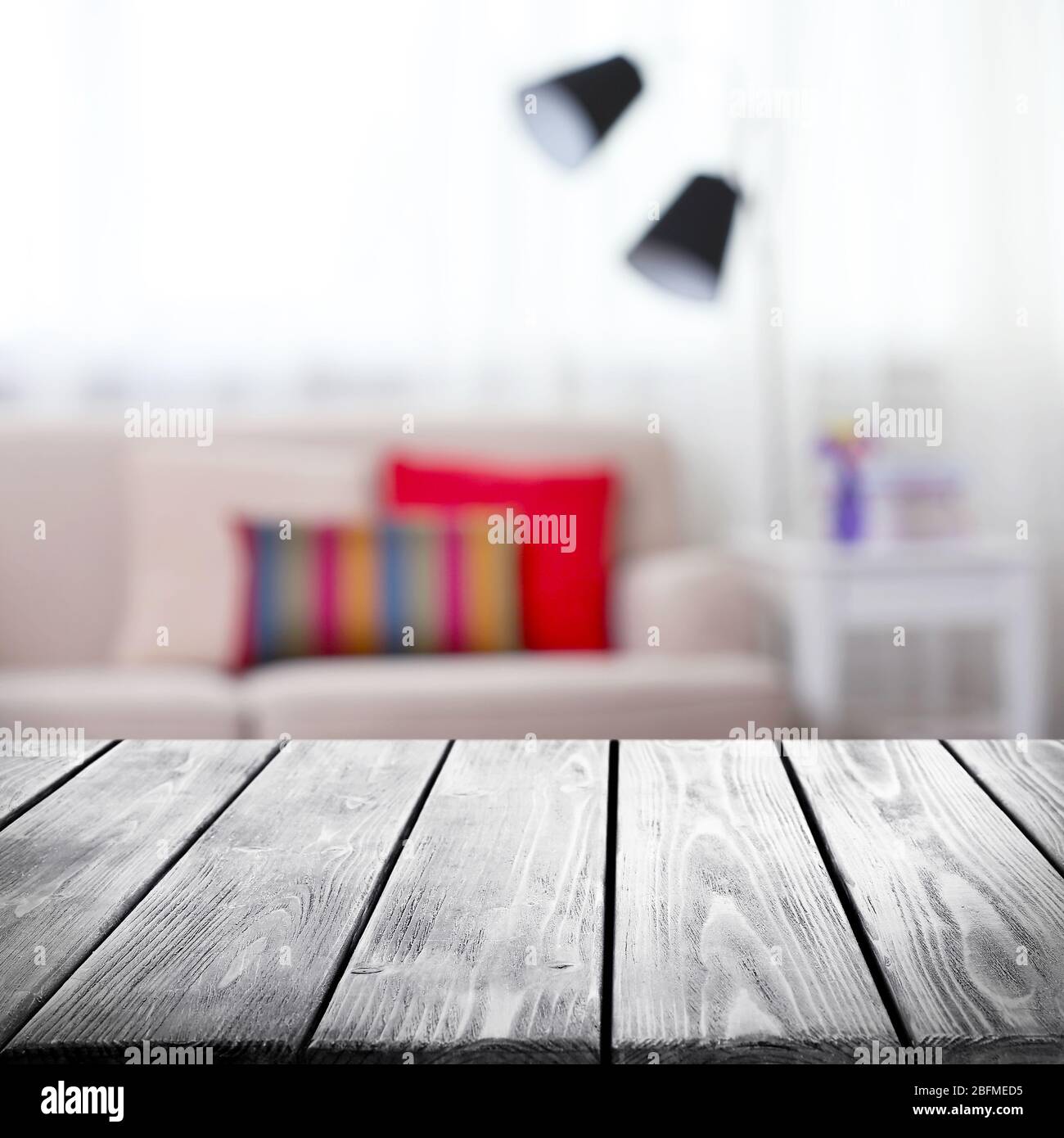 Empty wooden table and blurred room interior background Stock Photo - Alamy
