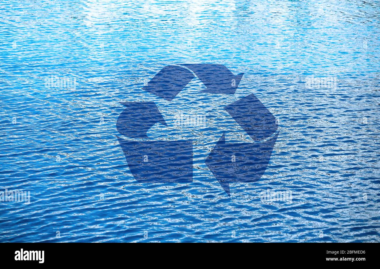 Recycling symbol on water background Stock Photo - Alamy