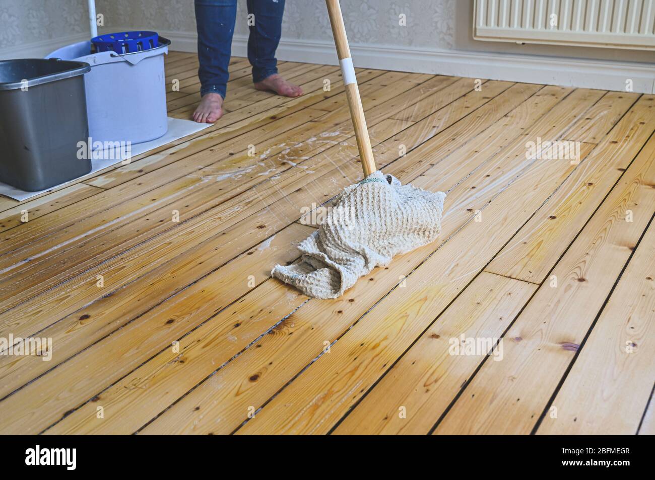 spring cleaning wooden floor with soft soap Stock Photo - Alamy