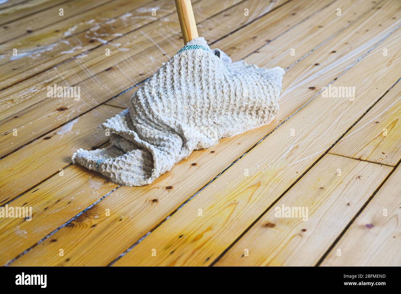 spring cleaning wooden floor with soft soap Stock Photo - Alamy