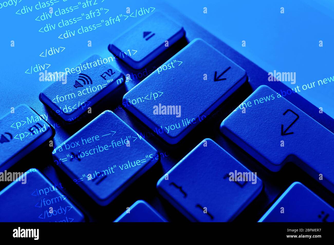 Computer keyboard with program code Stock Photo - Alamy