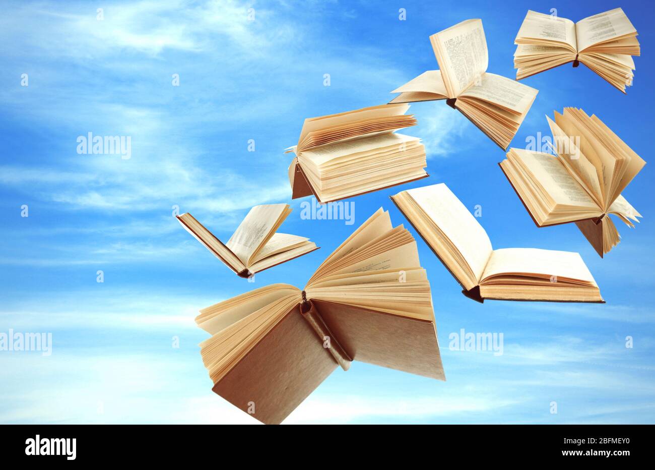 Many books on blue sky hi-res stock photography and images - Alamy