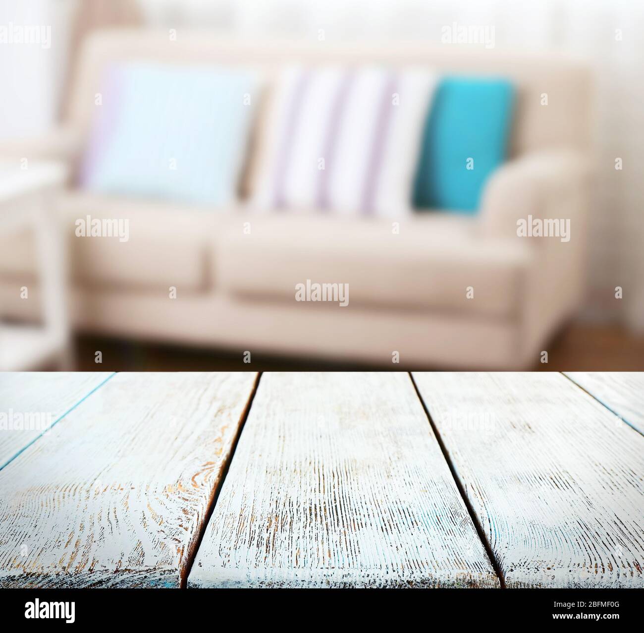 Empty wooden table and blurred room interior background Stock Photo - Alamy
