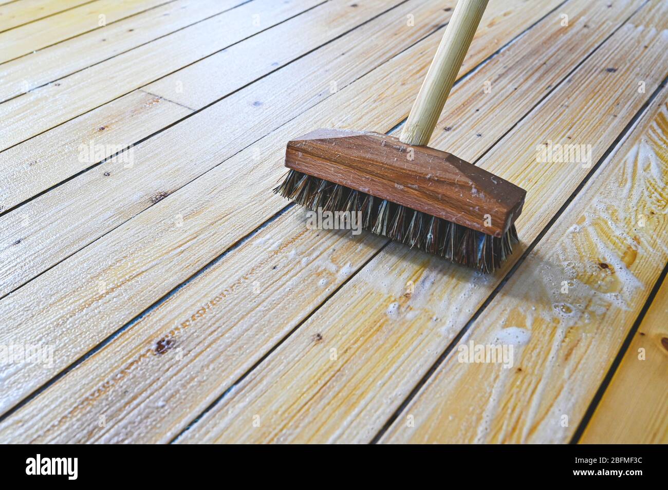 spring cleaning wooden floor with soft soap Stock Photo - Alamy