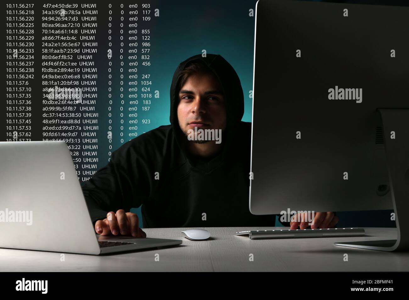 Hacker working with computer Stock Photo - Alamy