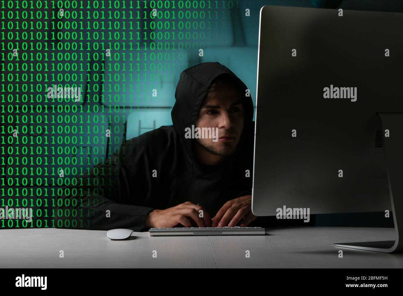 Hacker working with computer Stock Photo - Alamy