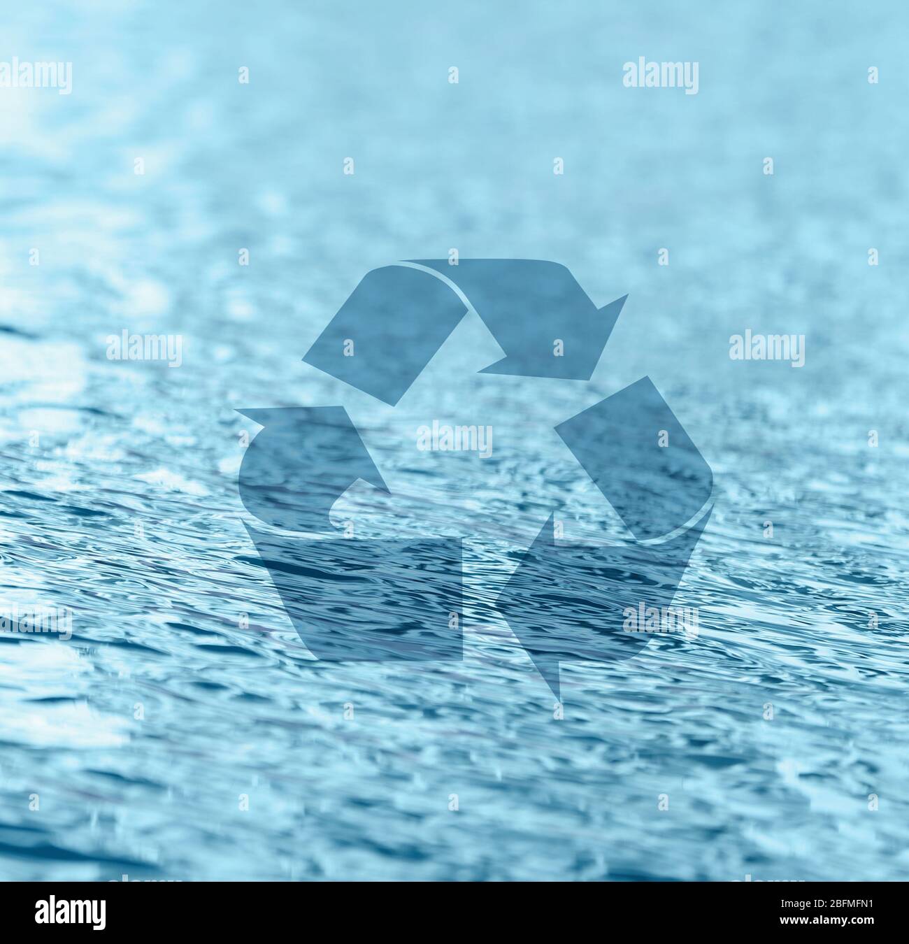 Recycling symbol on water background Stock Photo - Alamy