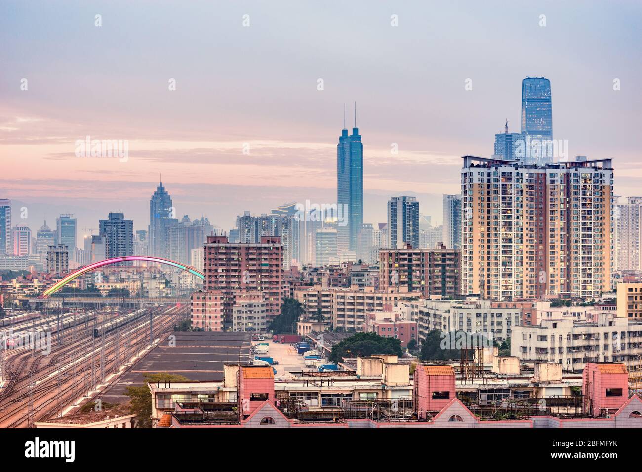 Cityscape and railway station at evening time. Shenzhen Stock Photo - Alamy