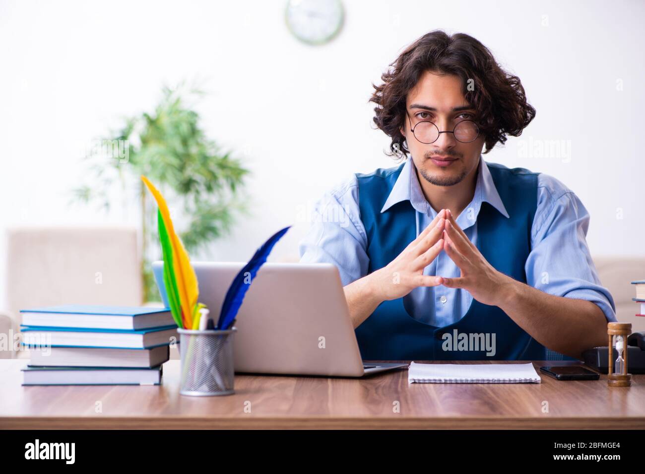 The young writer working on his new work Stock Photo - Alamy
