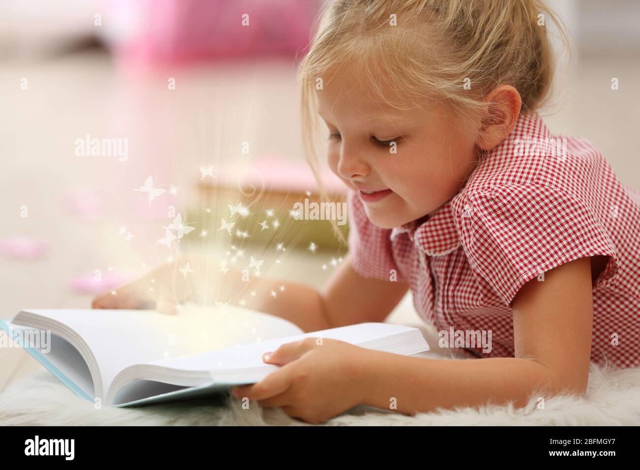 Child with magic book Stock Photo - Alamy
