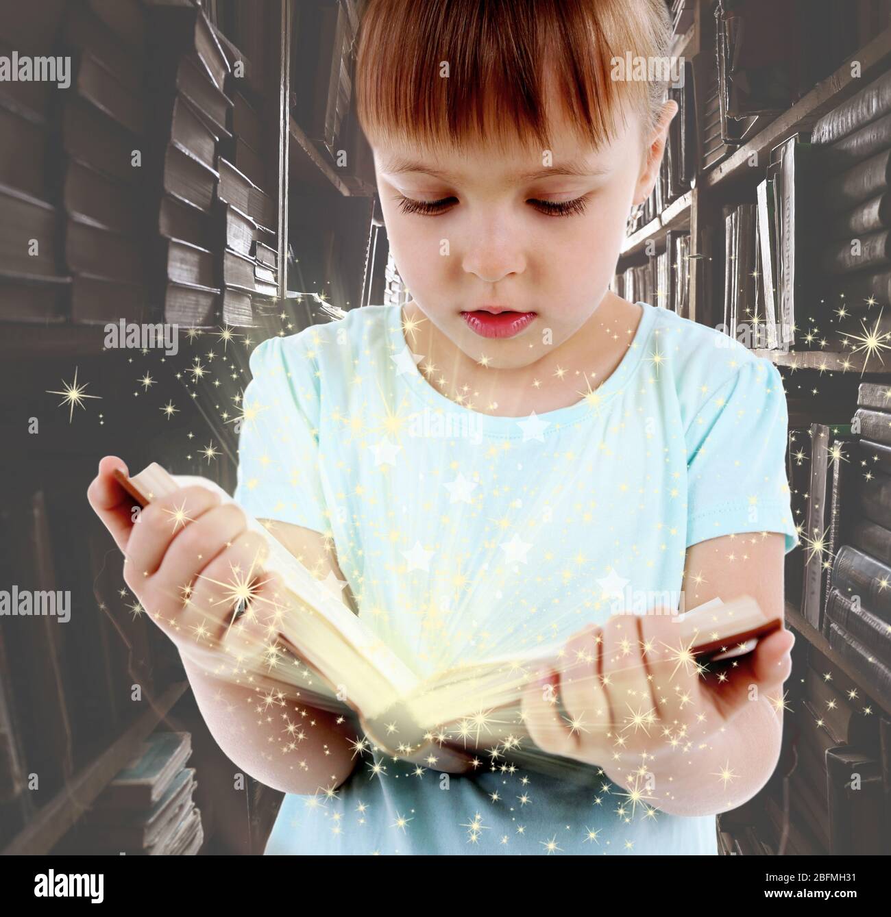 Child with magic book Stock Photo - Alamy