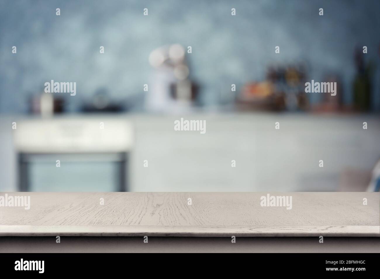Empty wooden table and blurred kitchen background Stock Photo - Alamy