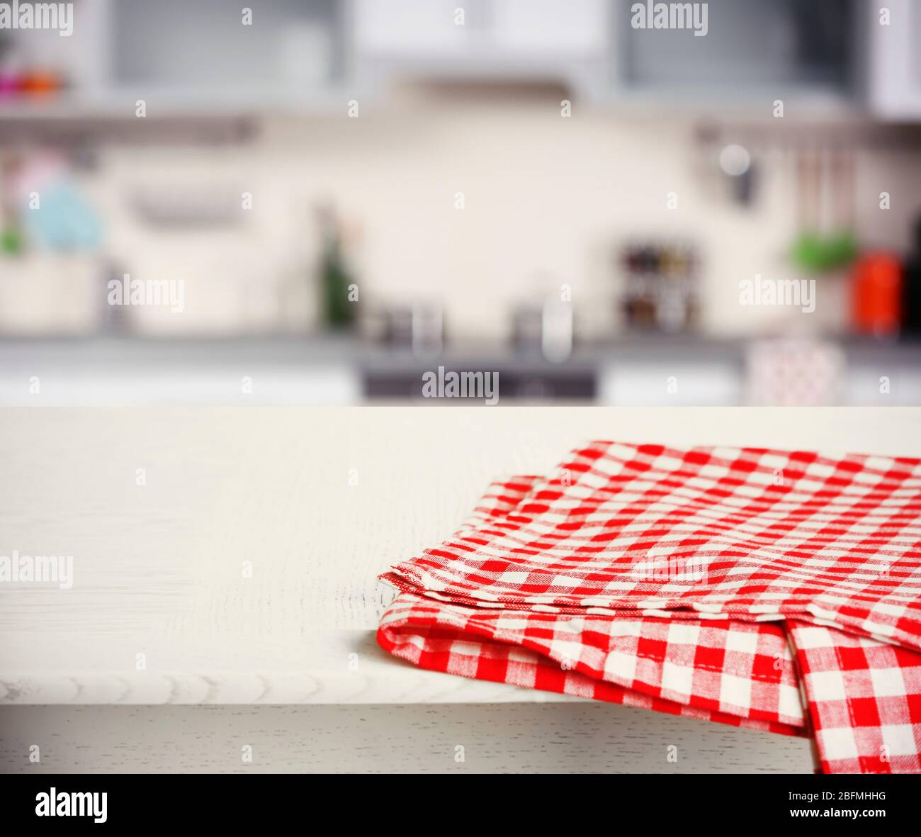 Wooden table and blurred kitchen background Stock Photo - Alamy