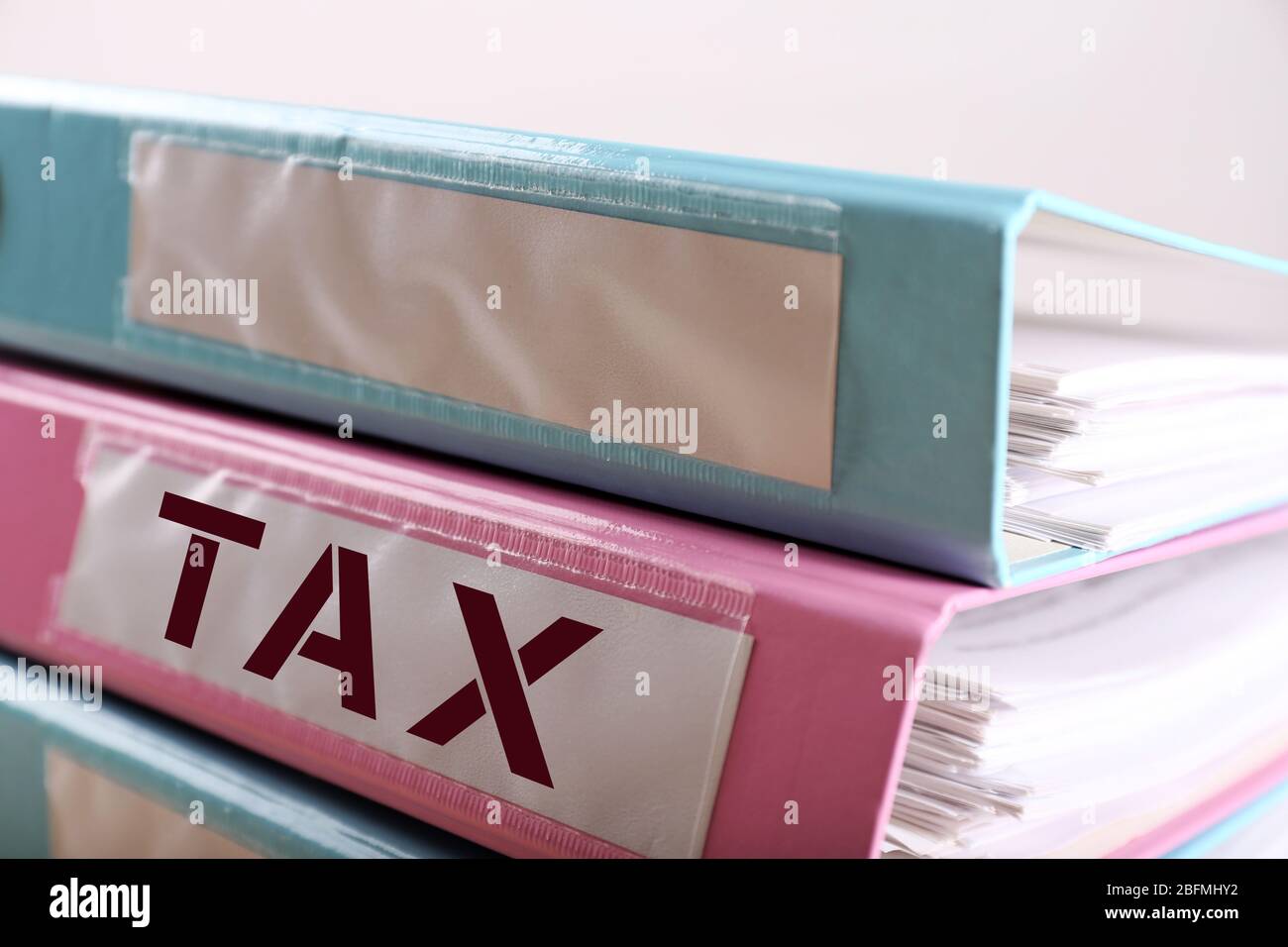Tax label on business document folder, close up Stock Photo - Alamy